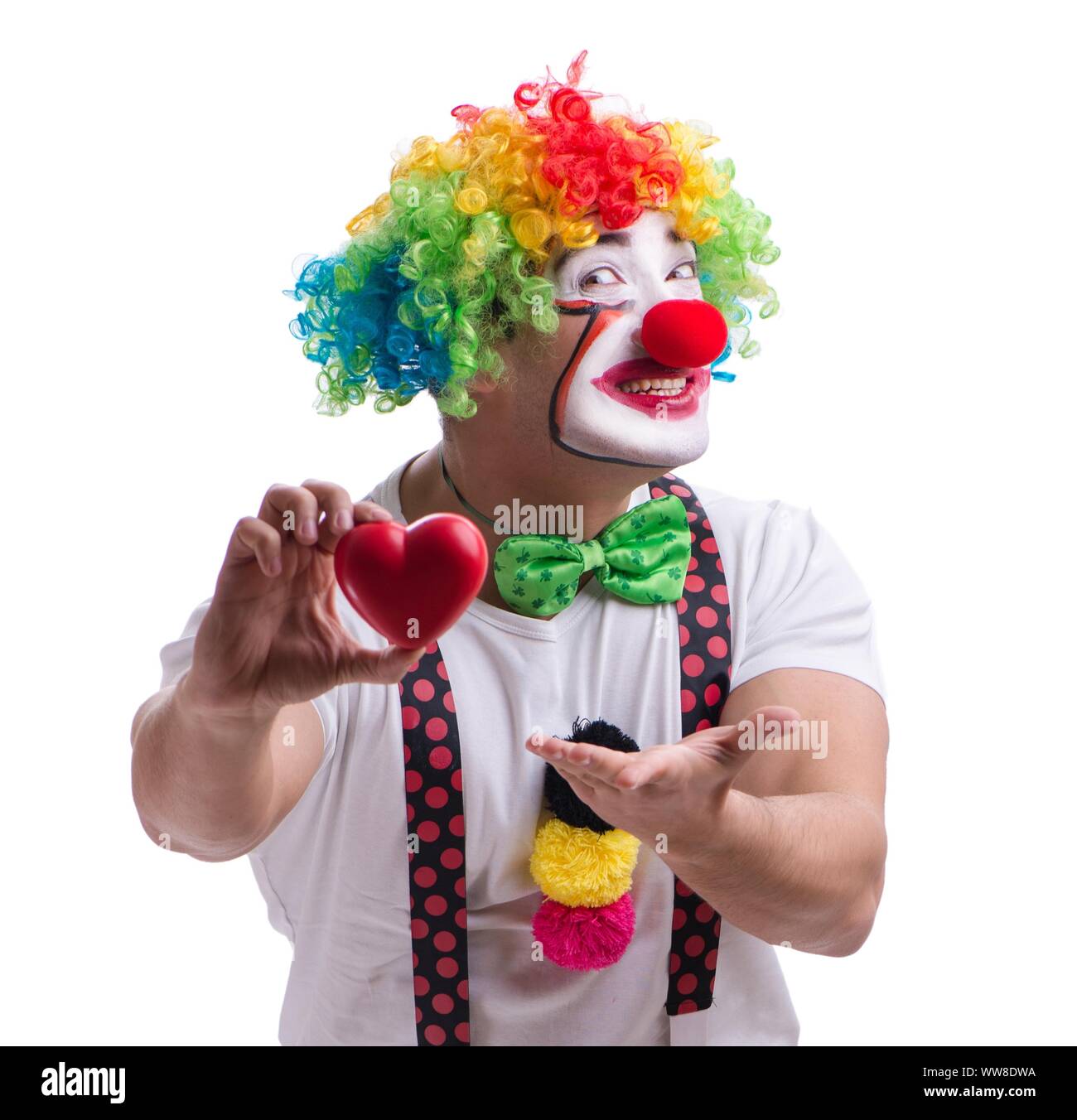 The funny clown with a heart isolated on white background Stock Photo ...