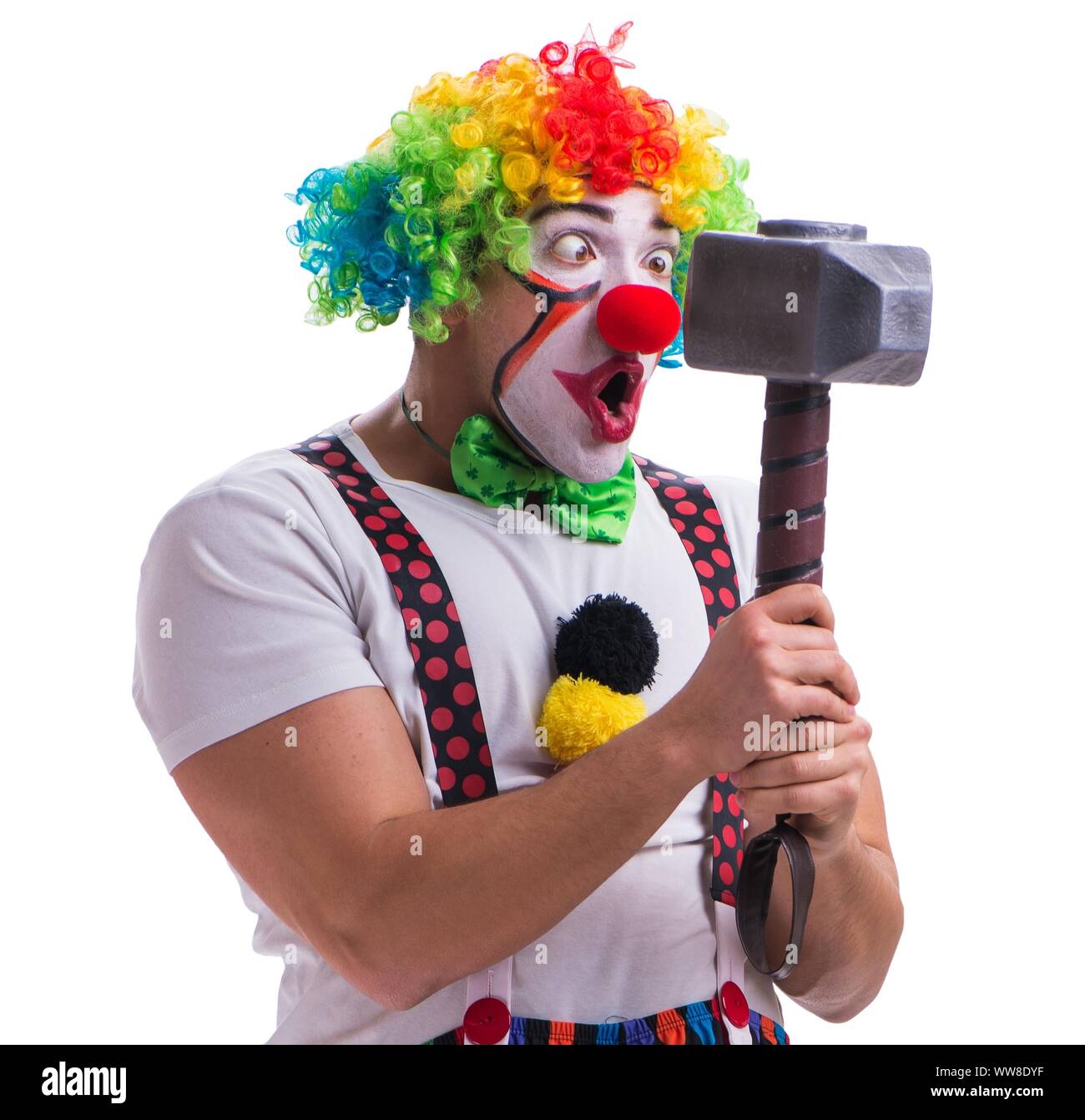 The funny clown with a hammer isolated on white background Stock Photo ...