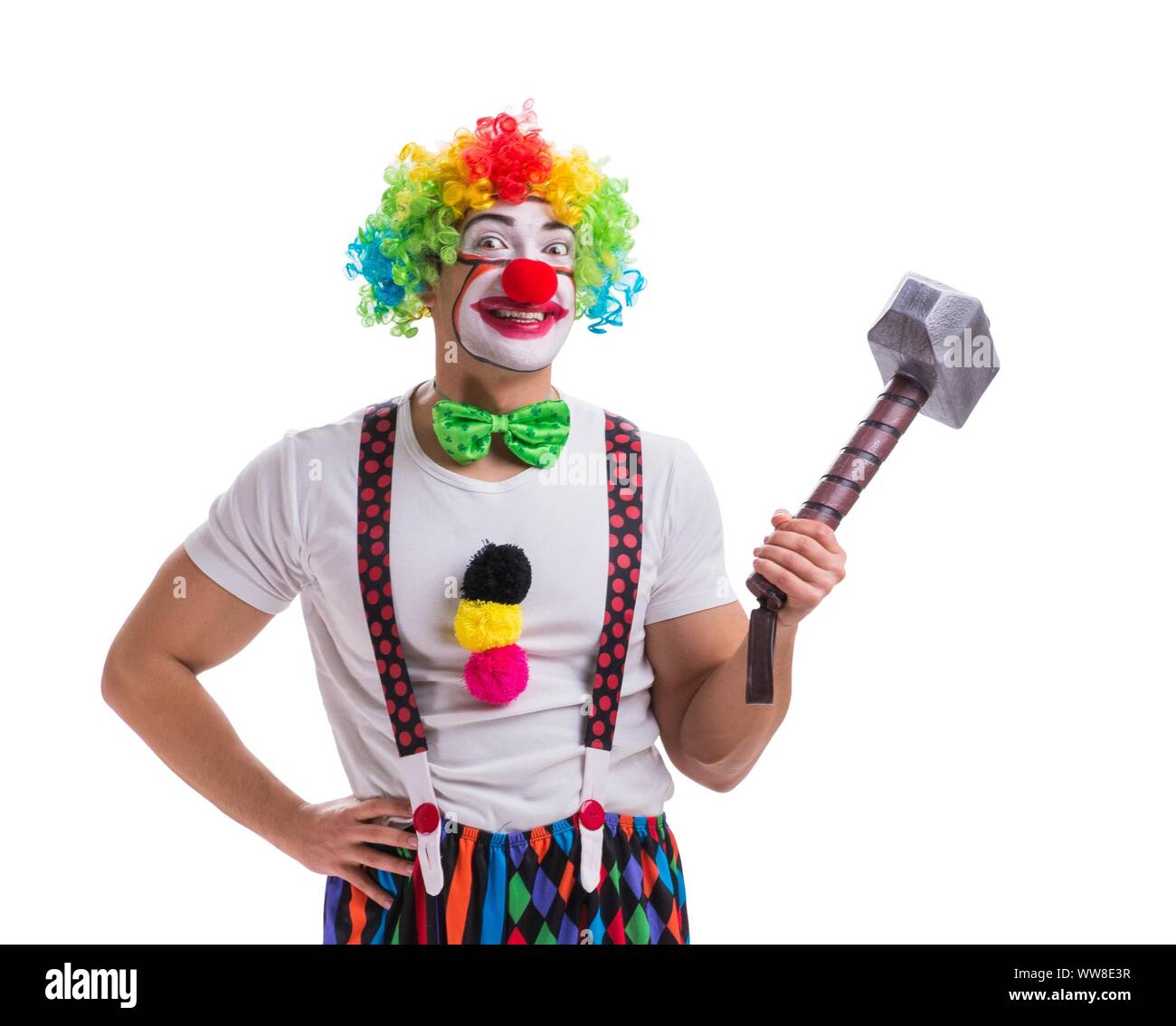 The funny clown with a hammer isolated on white background Stock Photo ...