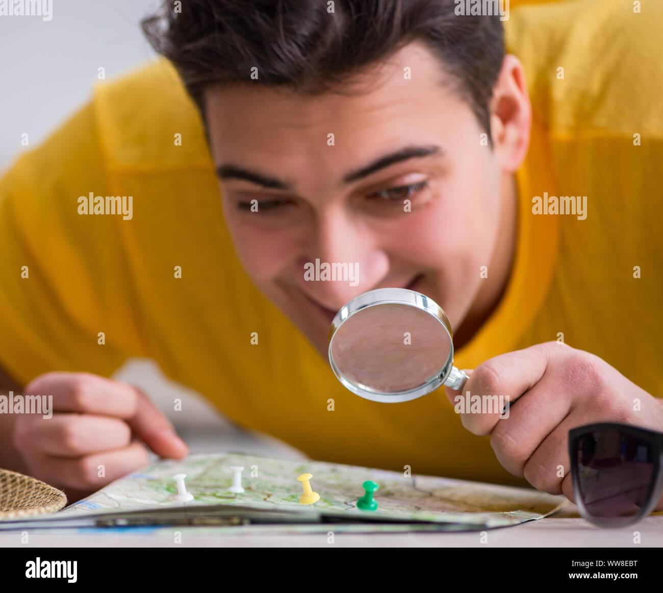 The man planning his vacation trip with map Stock Photo - Alamy