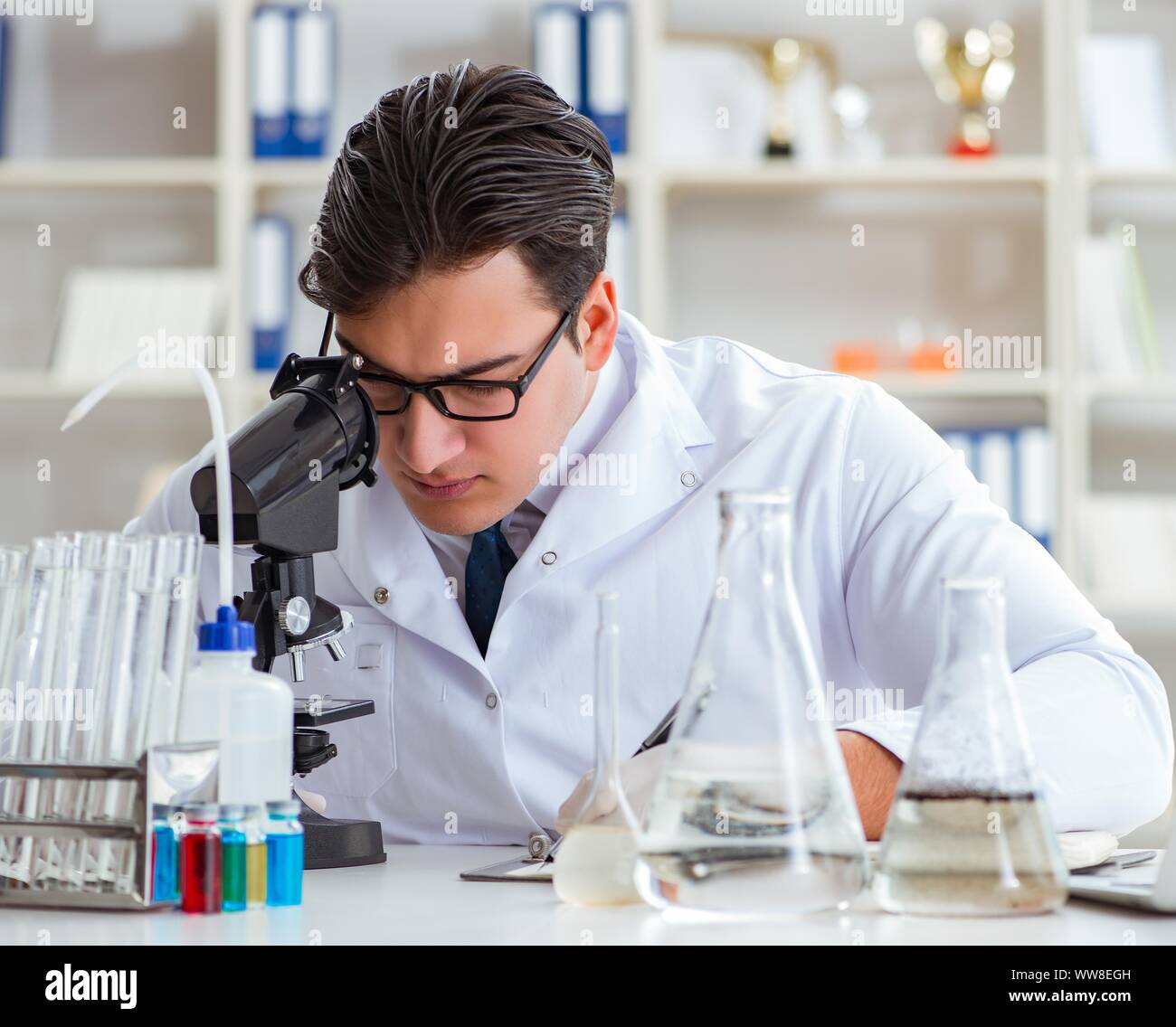 Young researcher scientist doing a water test contamination experiment ...