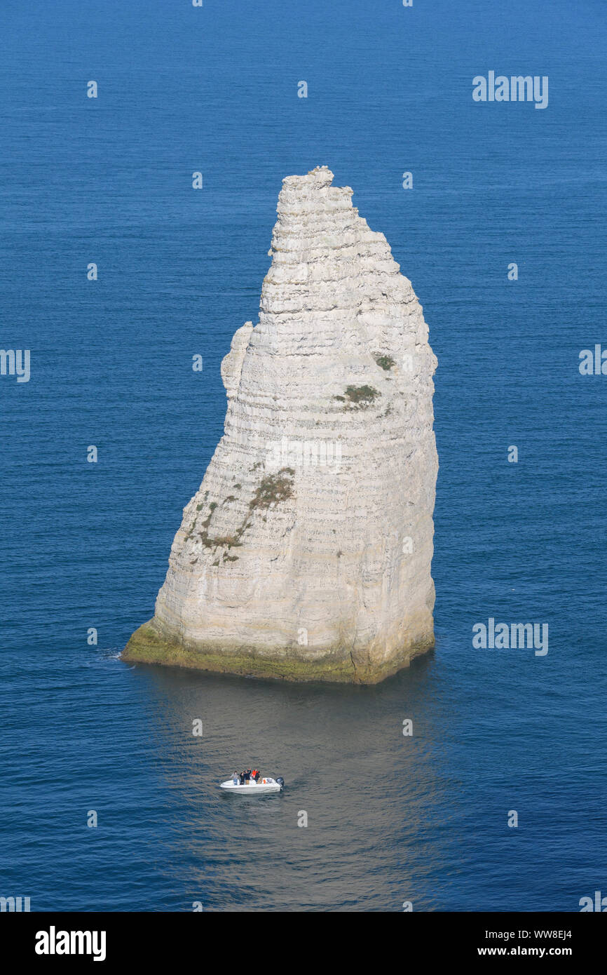 The needle limestone cliff and boat, Etretat, Seine-Maritime Department ...