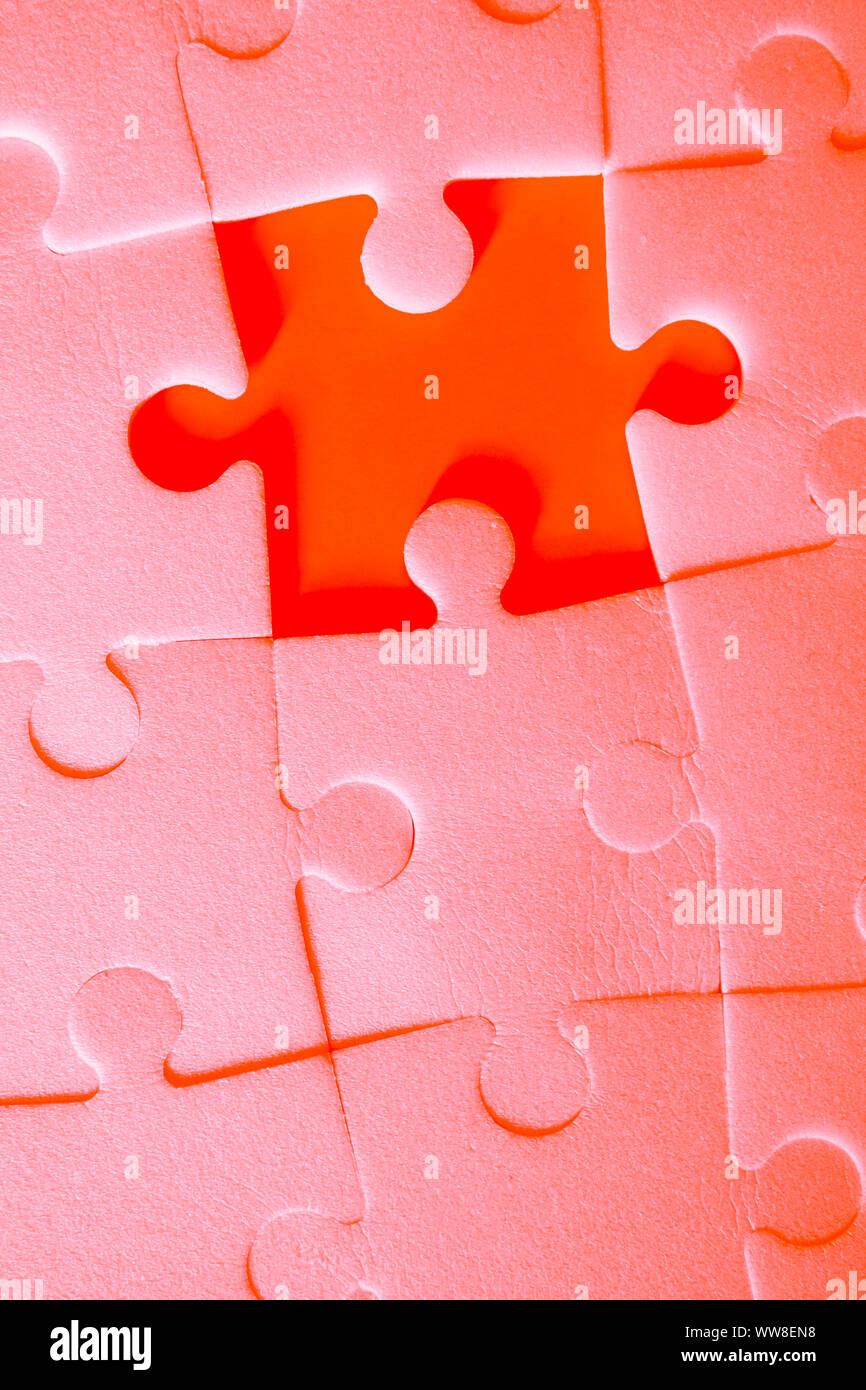 Multiple white puzzle pieces put together without one piece. View from ...