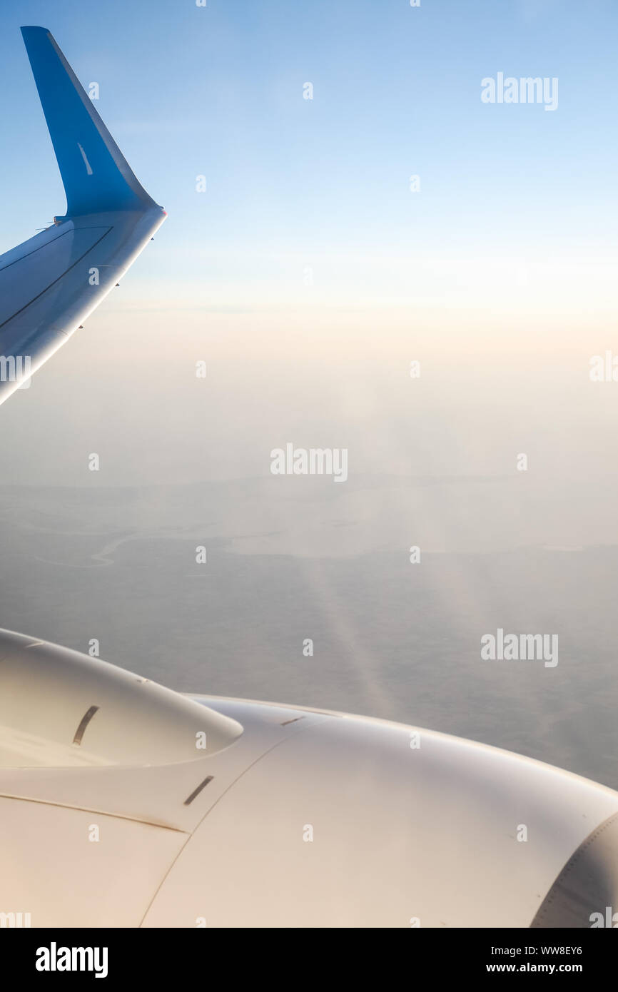Airplane flight by a beautiful sunny day of summer vacation Stock Photo ...