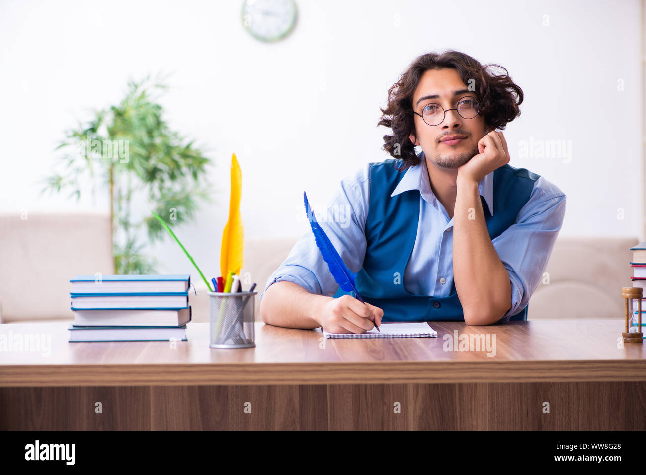 The young writer working on his new work Stock Photo - Alamy