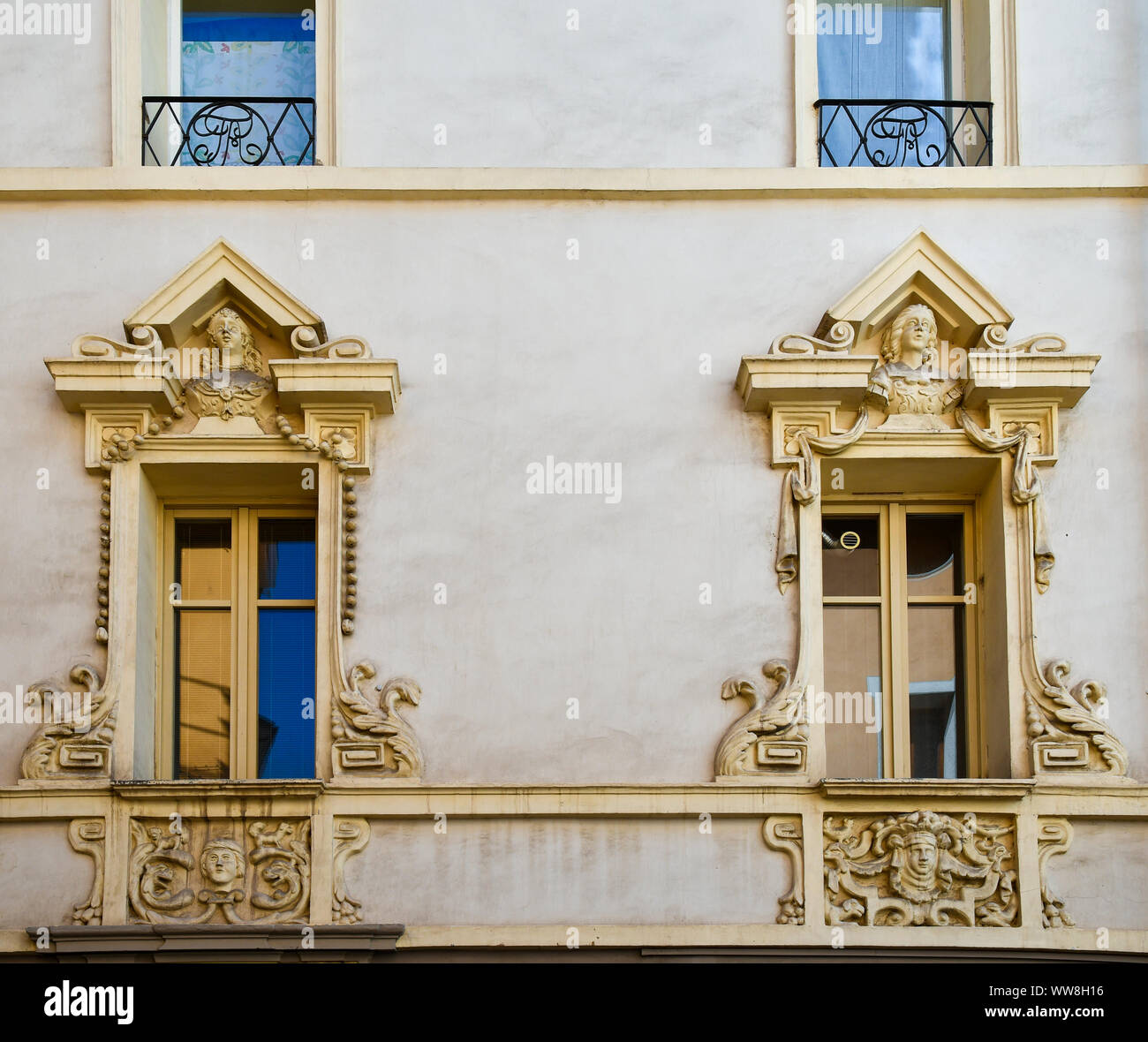Exterior of an ancient palace with neoclassical portrait busts and bas ...