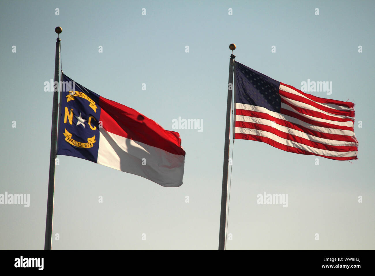 The flag of North Carolina and the U.S. flag waving Stock Photo - Alamy