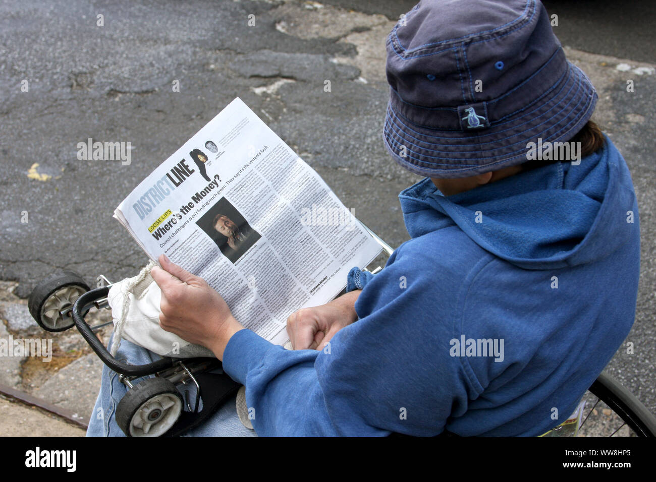 Person reading a newspaper in Washington DC, USA Stock Photo - Alamy