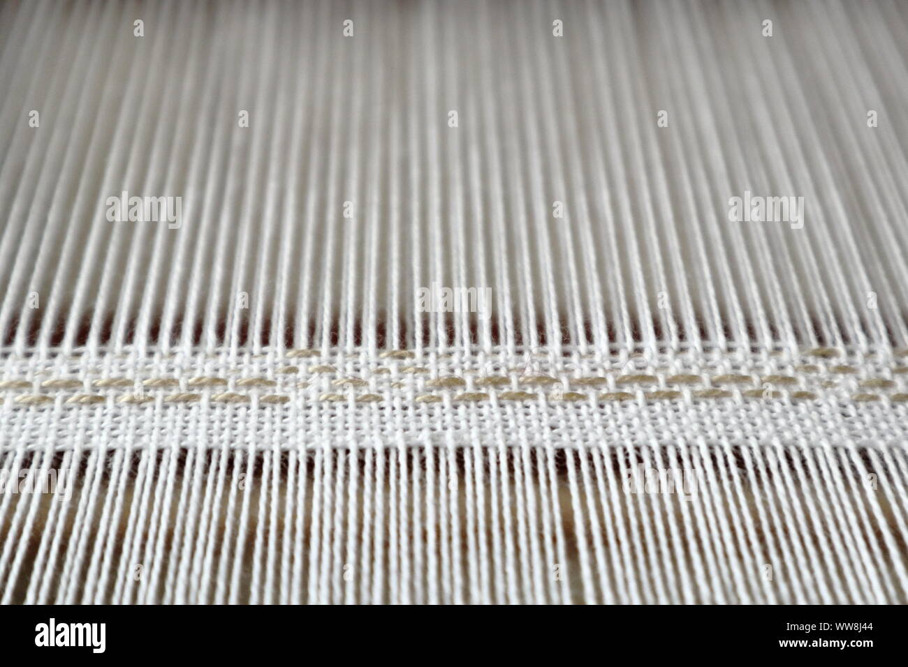 White cotton warp with the start of summer and winter weaving pattern ...