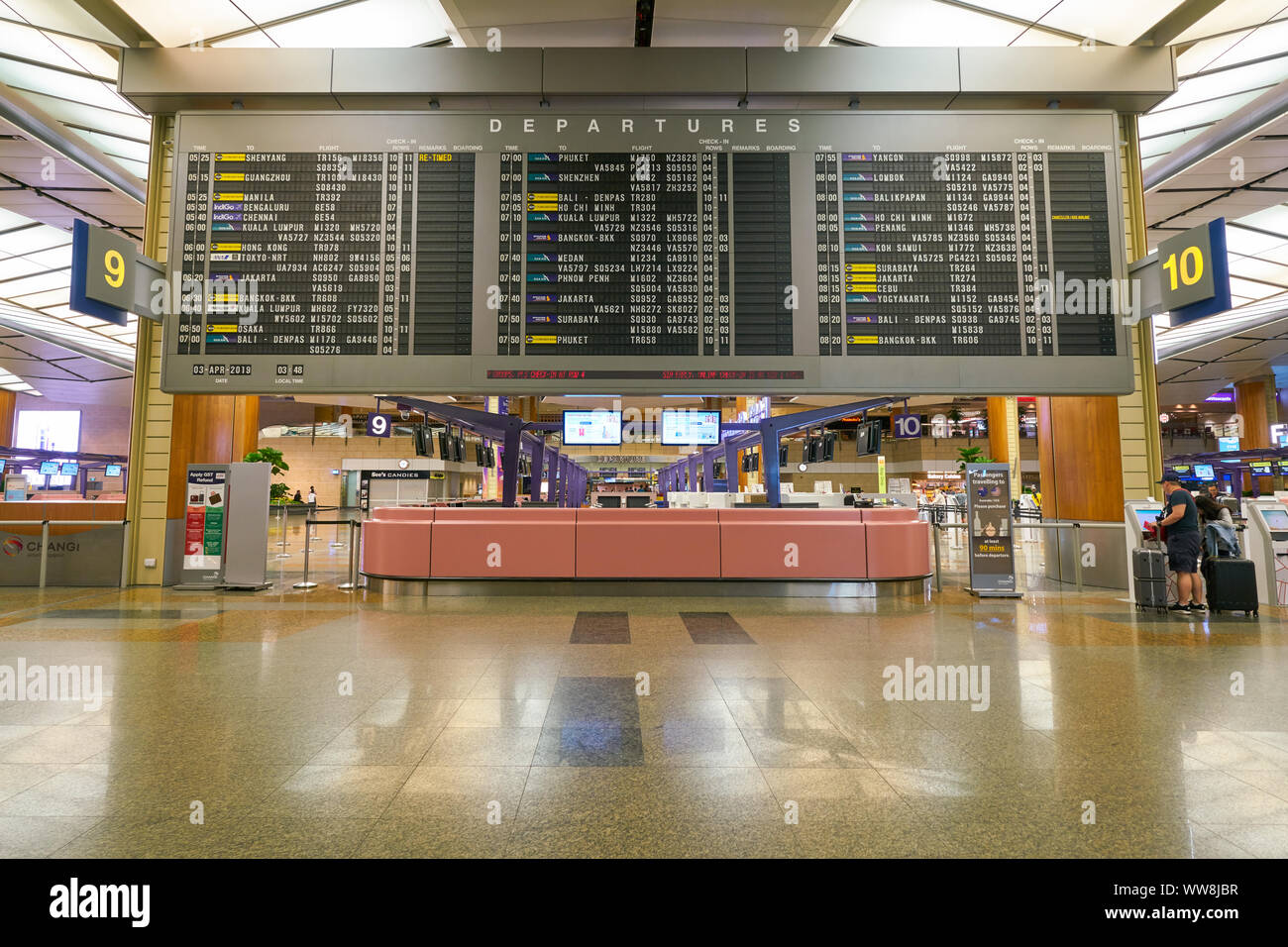 SINGAPORE - CIRCA APRIL, 2019: a flight information display at ...