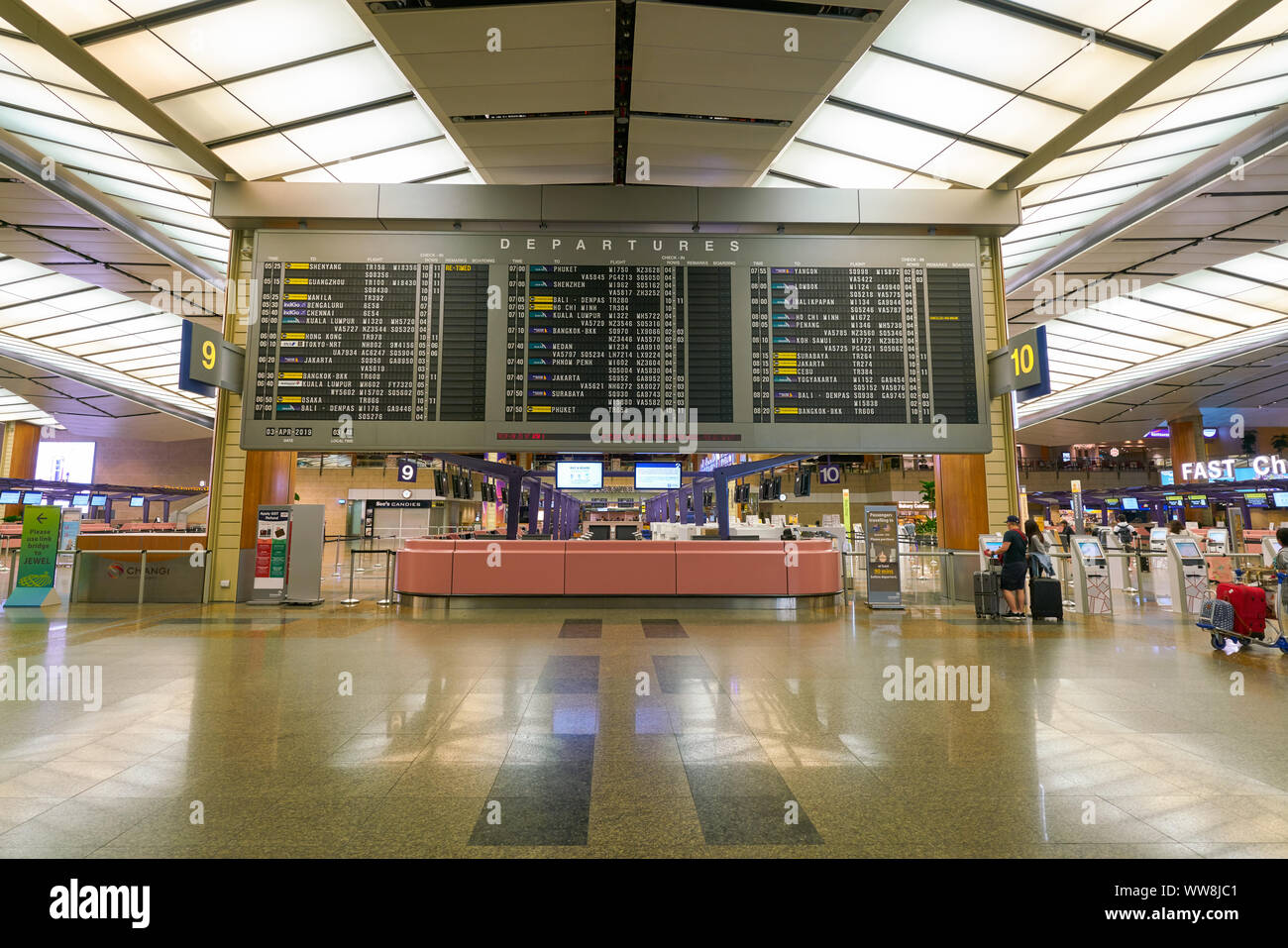 SINGAPORE - CIRCA APRIL, 2019: a flight information display at ...