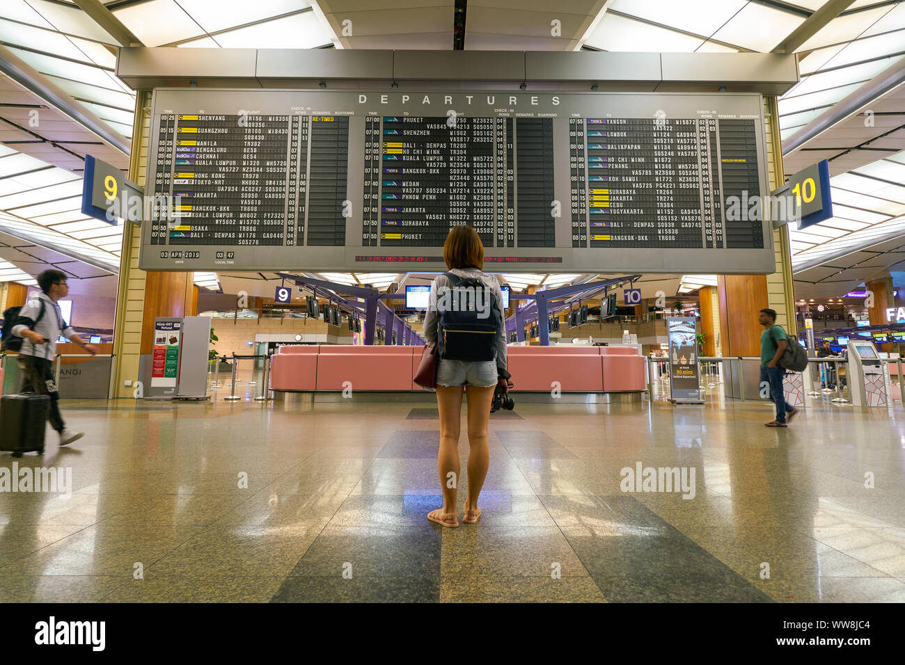Flight information board screen changi hi-res stock photography and ...