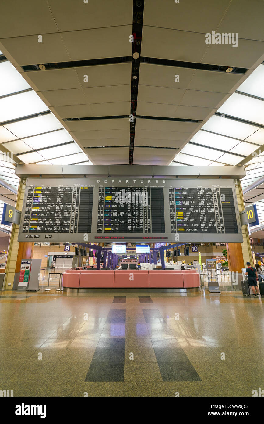 SINGAPORE - CIRCA APRIL, 2019: a flight information display at ...