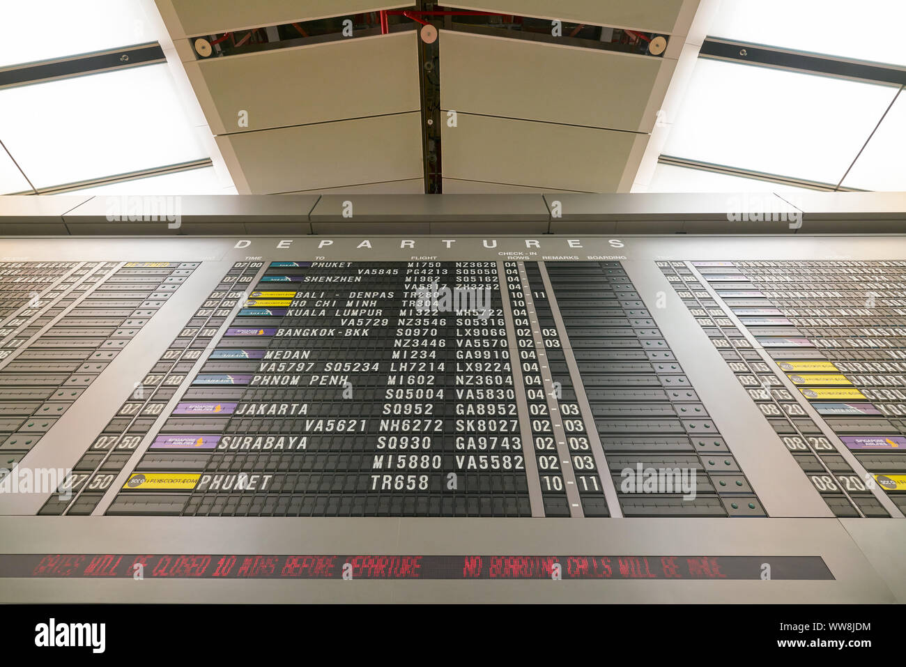 SINGAPORE - CIRCA APRIL, 2019: a flight information display at ...