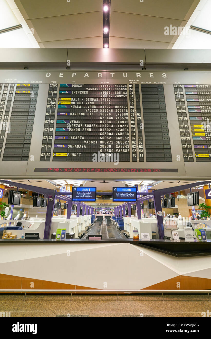 SINGAPORE - CIRCA APRIL, 2019: a flight information display at ...