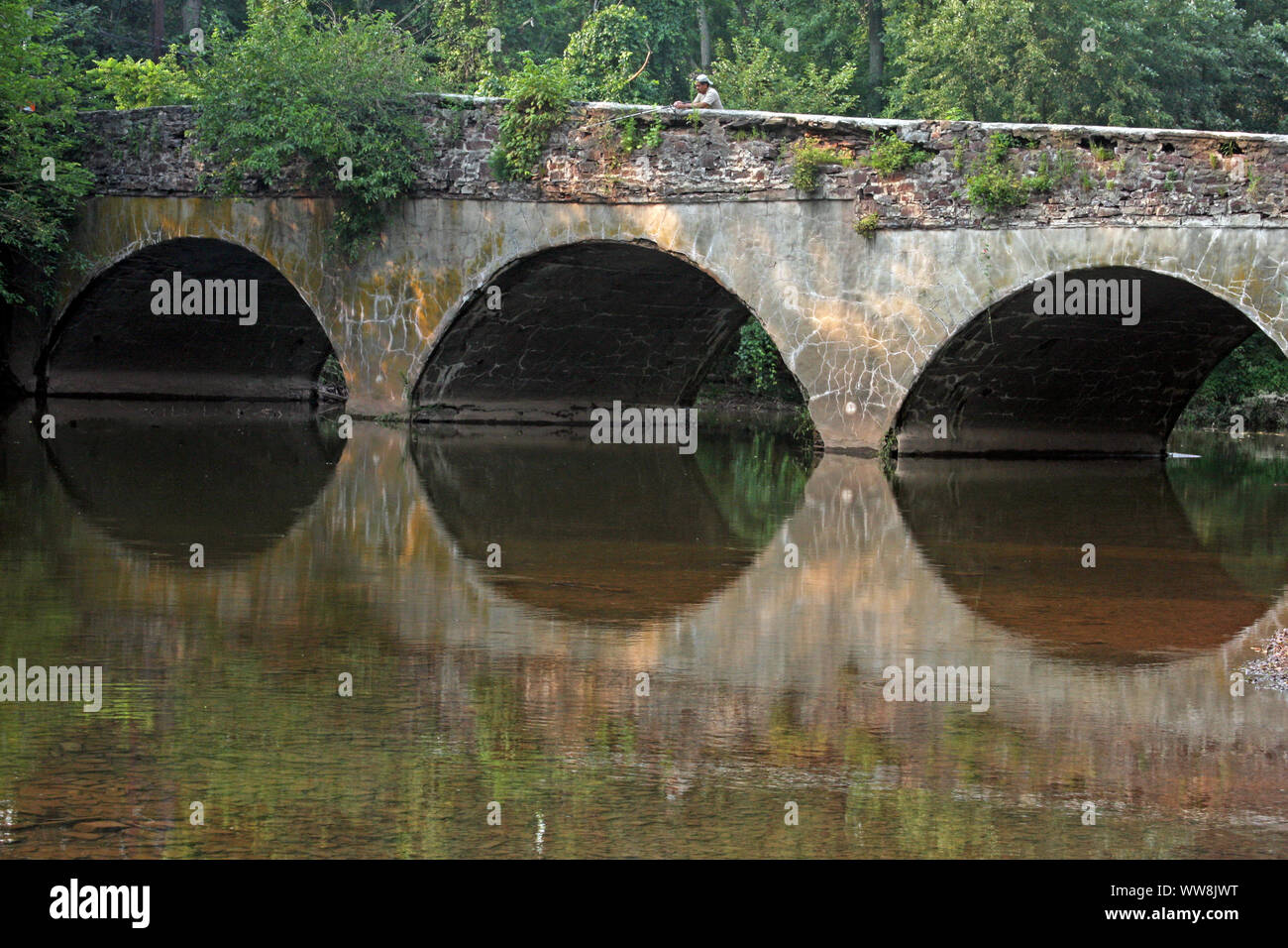 Stone bridge over river and reflection Stock Photo - Alamy