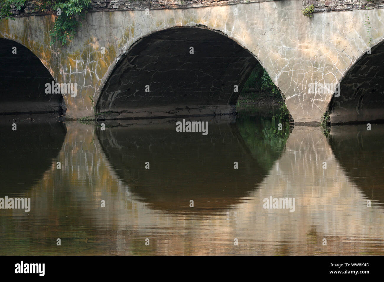 Stone bridge over river and reflection Stock Photo - Alamy