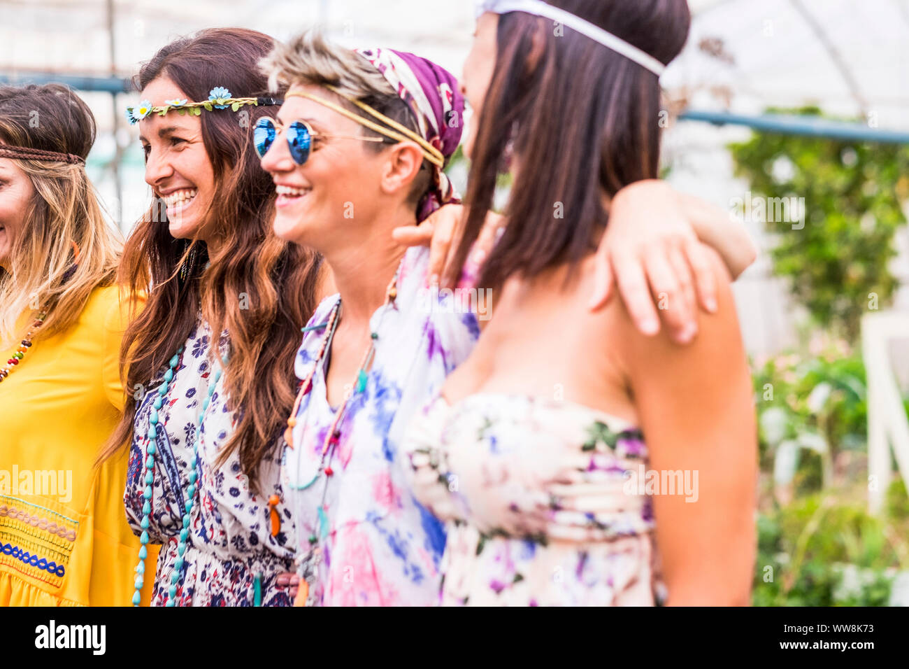 nice group of cacuasian colored clothes young woman stay together in ...