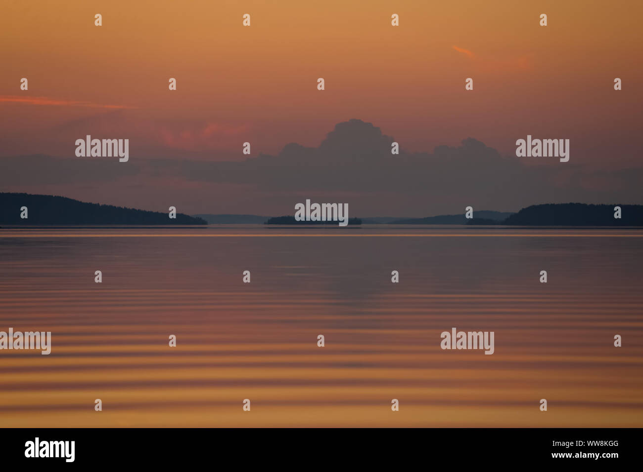 Sunset color reflections on water surface, lakescape scenery, Finland ...