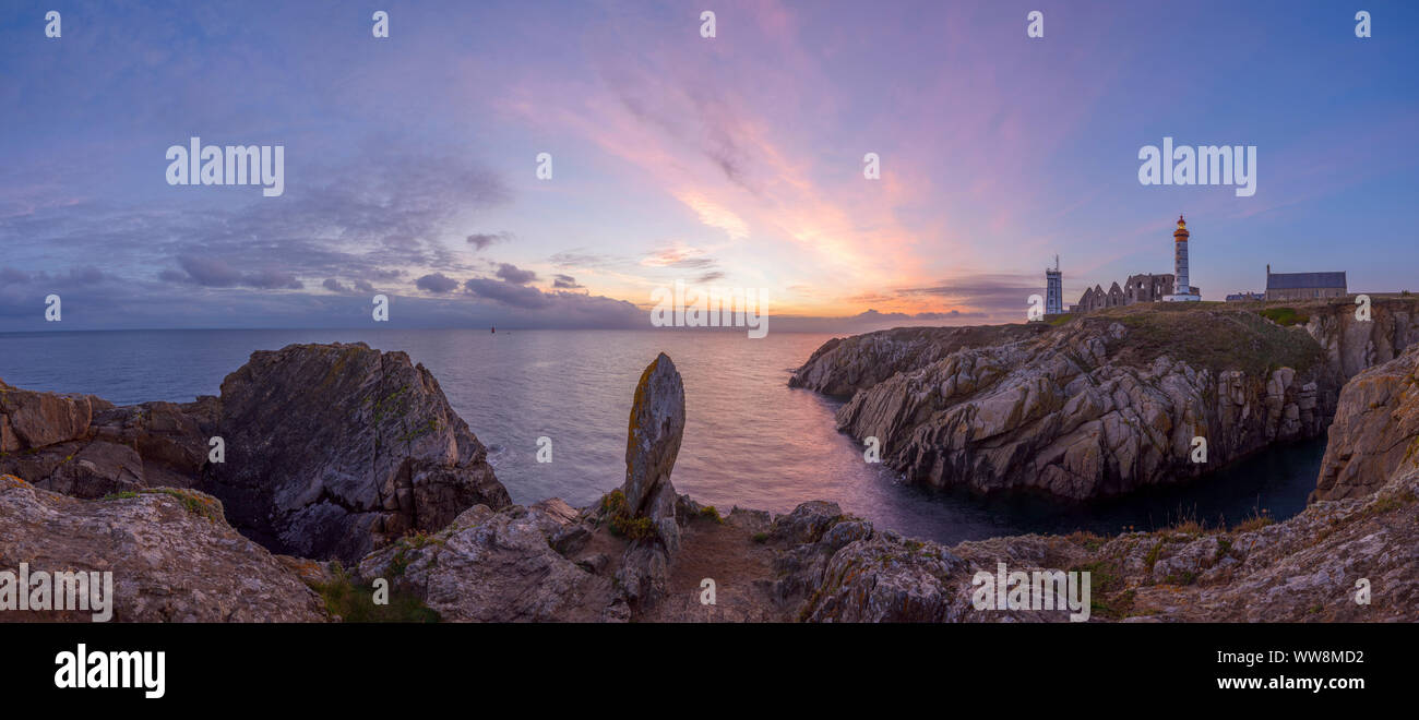 Bay with monolith and lighthouse at sunset, Saint Mathieu lighthouse ...