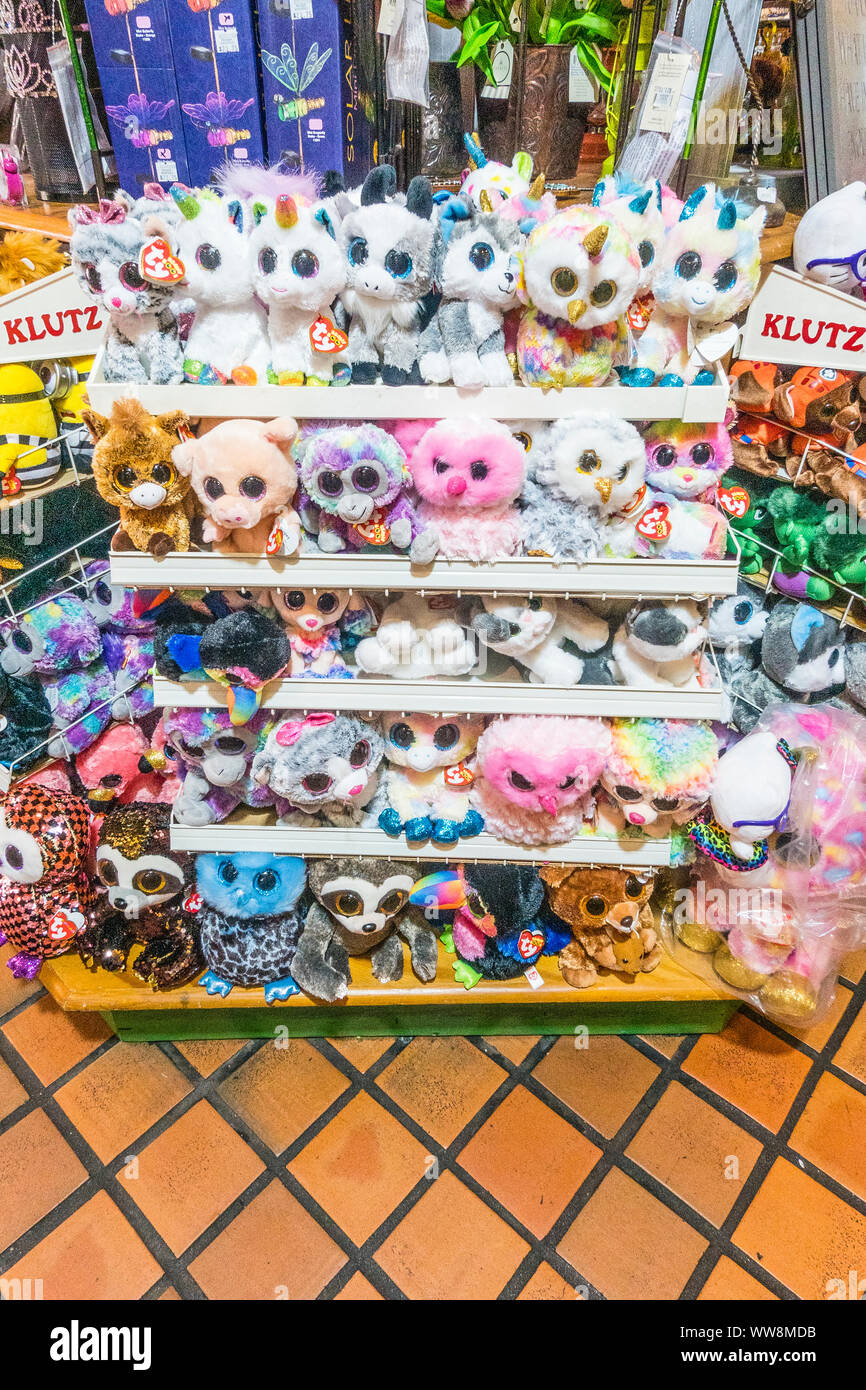A multitiered display of cuddly stuffed animals with oversize eyes ...