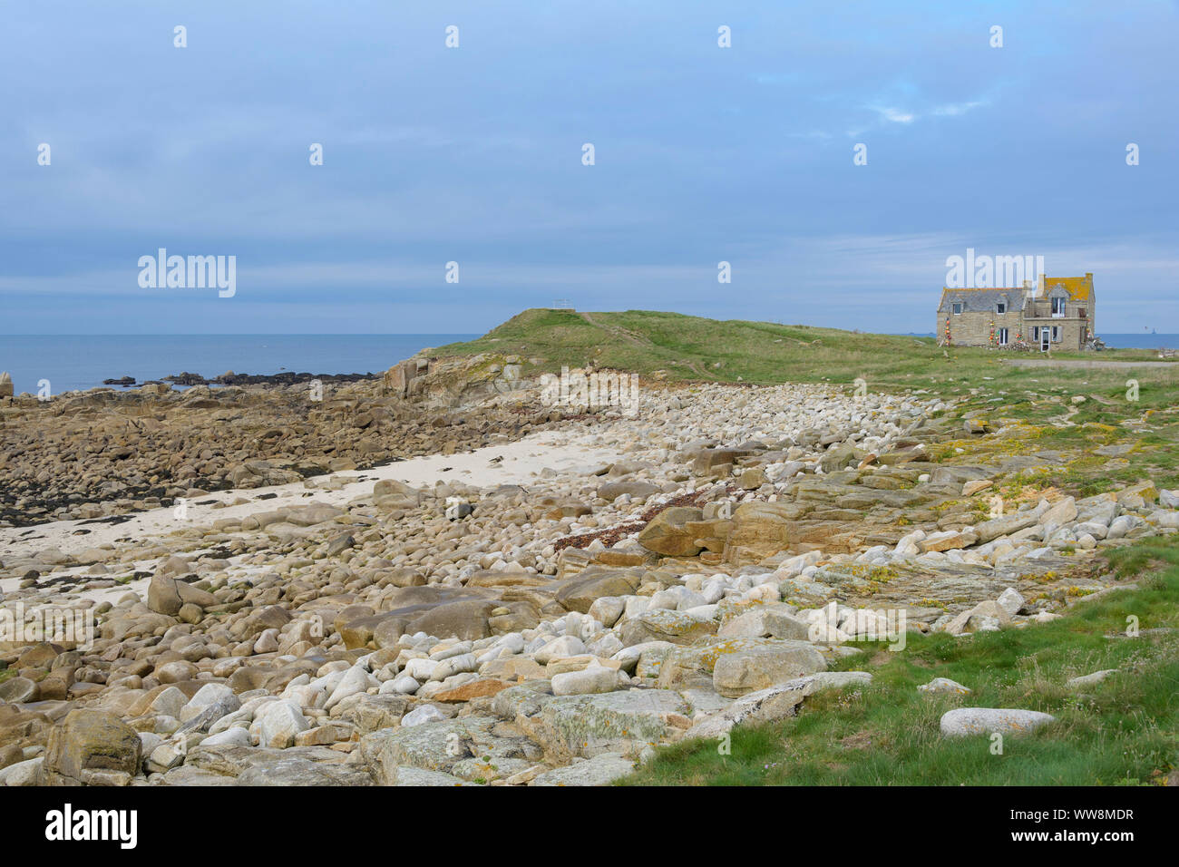 Old stone house on the coast with buoys, Lampaul-Plouarzel, Finistere ...