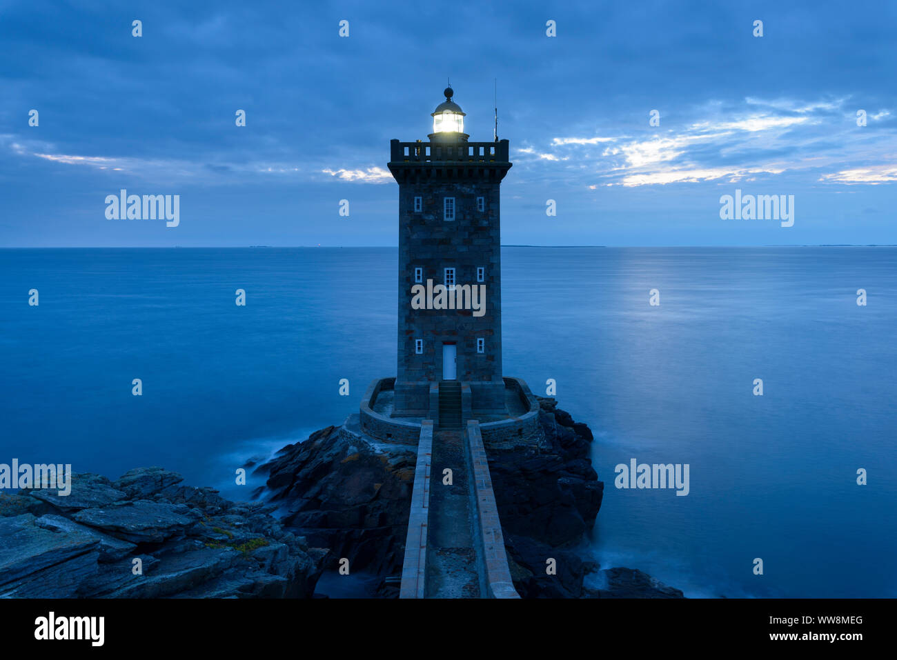 Phare de Kermorvan lighthouse with becon at dusk, Pointe de Kermorvan ...
