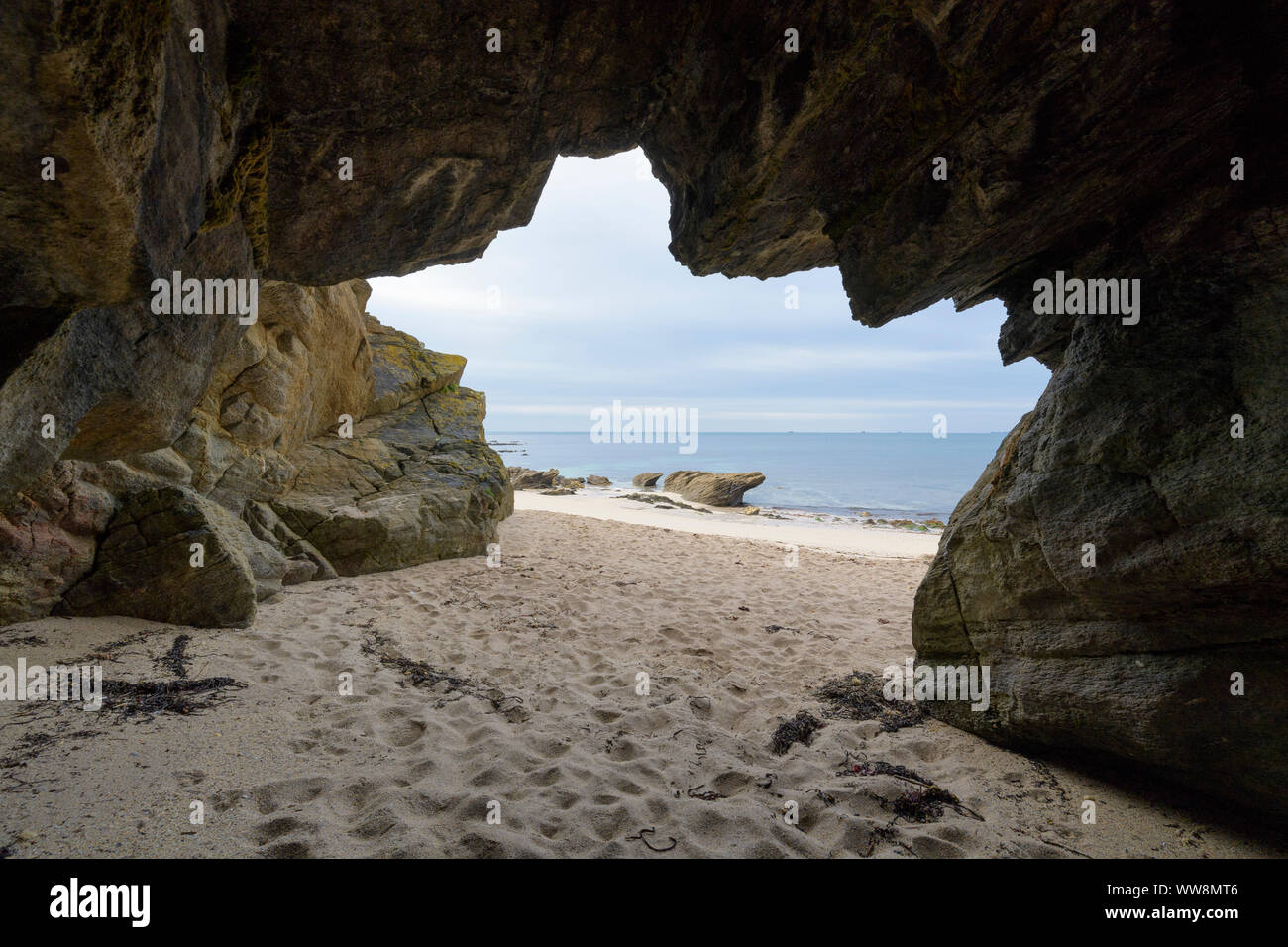 Cave in the rock on the beach, Plage de Ruscumunoc, Plouarzel ...