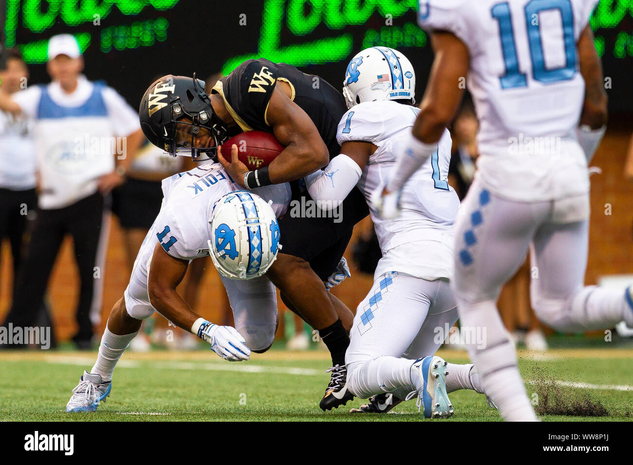 Winston-Salem, NC, USA. 13th Sep, 2019. Wake Forest Demon Deacons quarterback Jamie Newman (12 ...