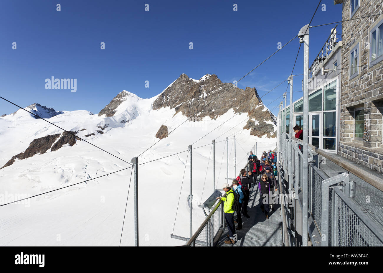 Tourists at sphinx observatory with view of aletsch glacier hi-res ...