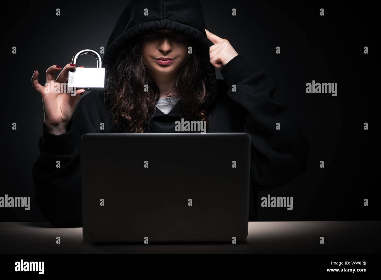 The female hacker hacking security firewall late in office Stock Photo ...