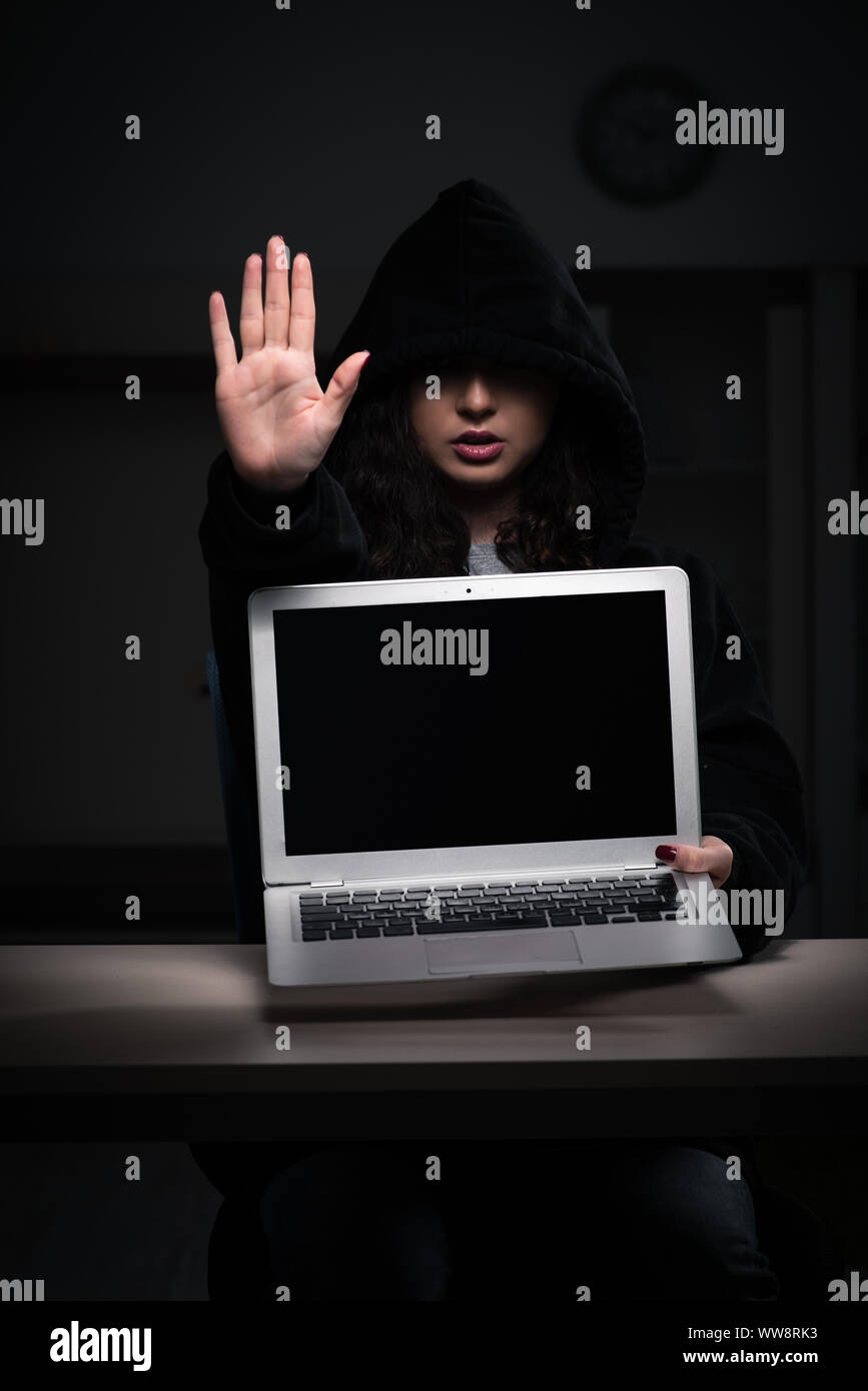 The female hacker hacking security firewall late in office Stock Photo ...