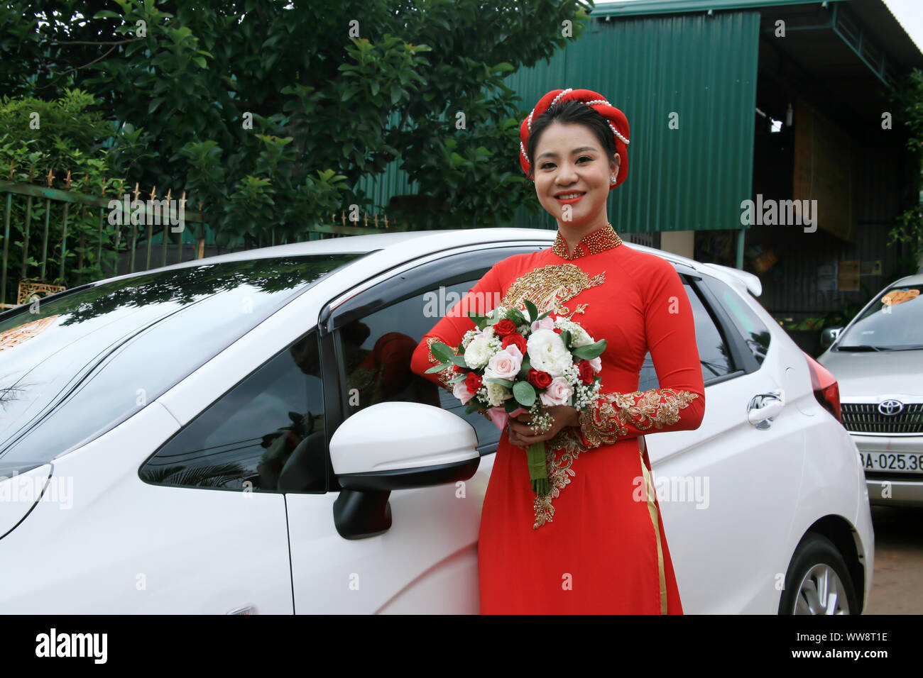Portrait bride wearing red dress hi-res stock photography and images ...