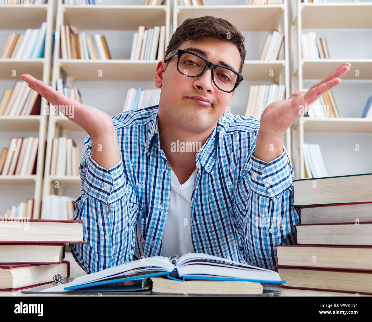 The young student studying with books Stock Photo - Alamy