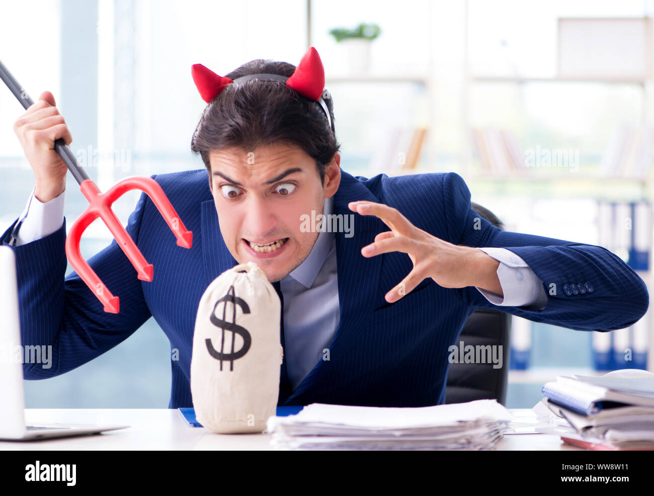 The devil angry businessman in the office Stock Photo - Alamy
