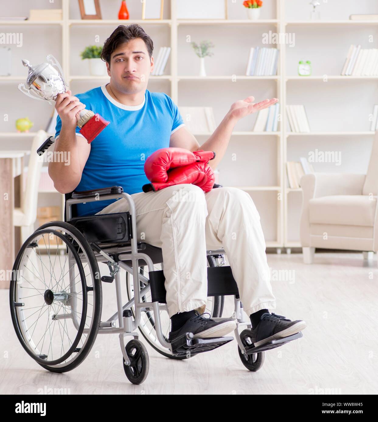 The disabled boxer at wheelchair recovering from injury Stock Photo - Alamy