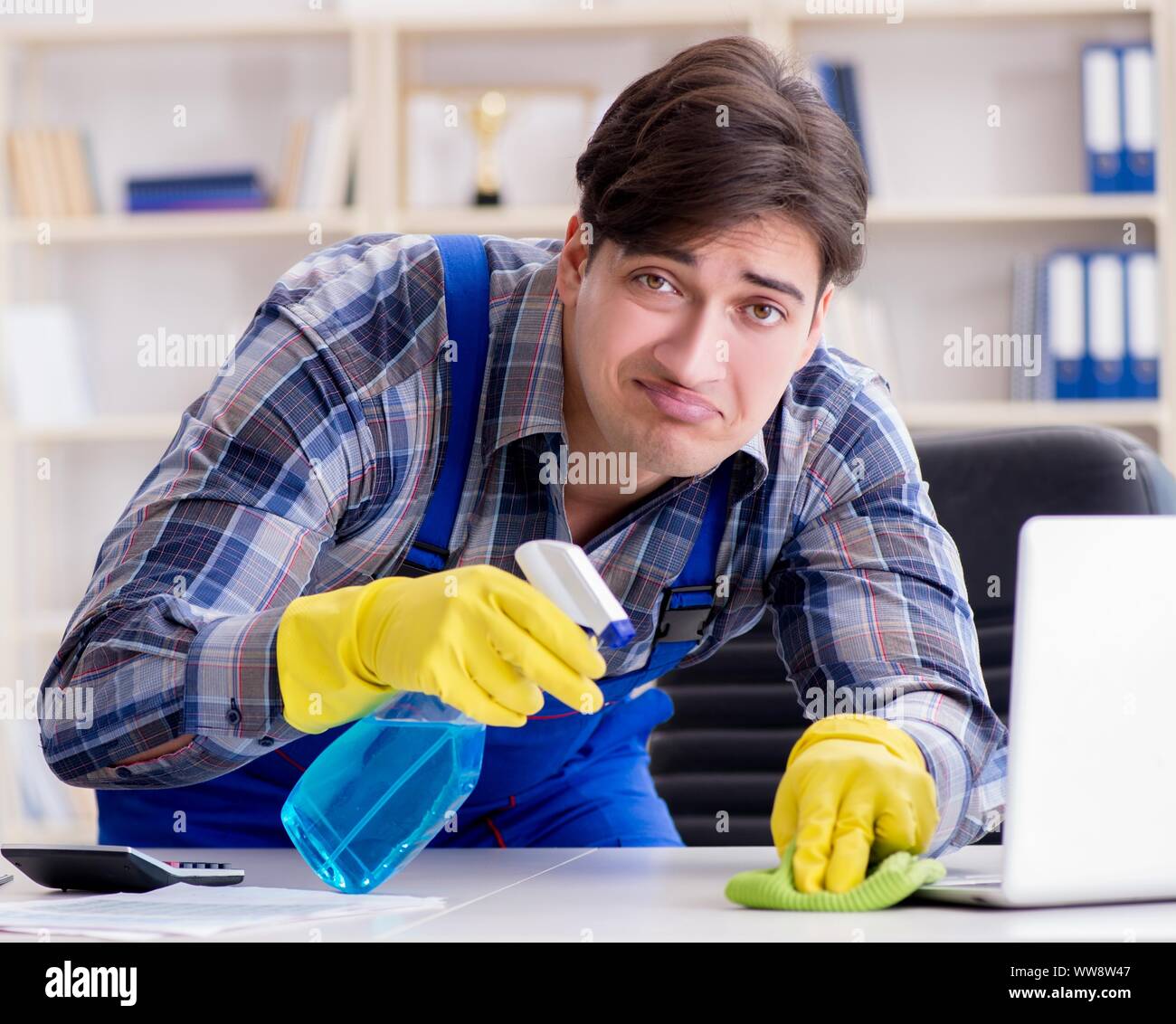 Tired male cleaner mopping hi-res stock photography and images - Alamy
