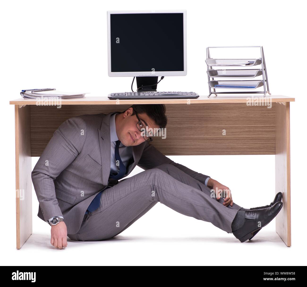 The businessman hiding in the ofice Stock Photo - Alamy