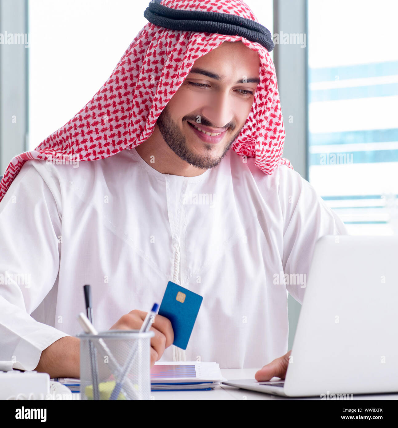 The arab businessman working in the office Stock Photo - Alamy