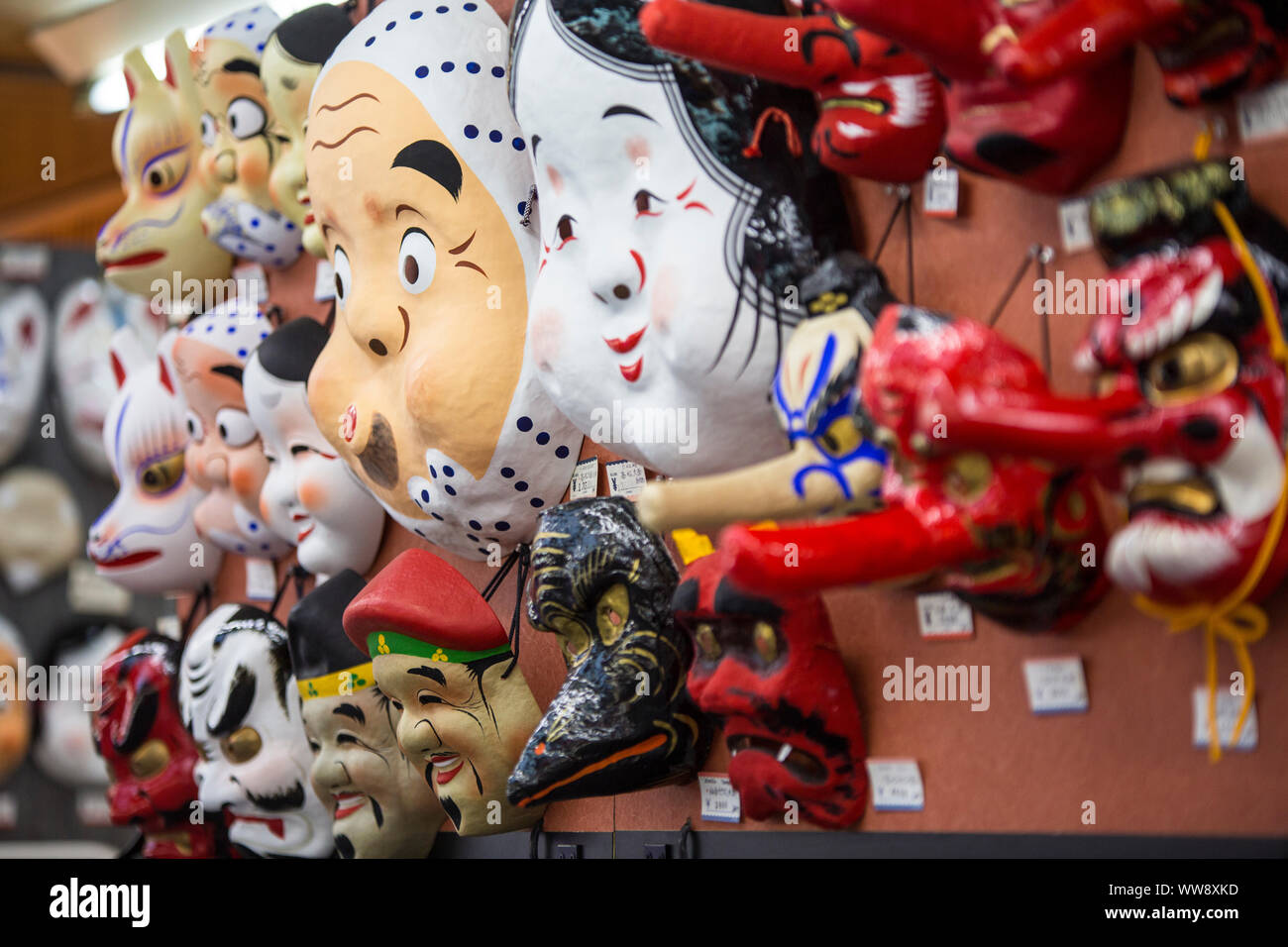 Traditional Japanese colorful mask red white and skin tone on display ...