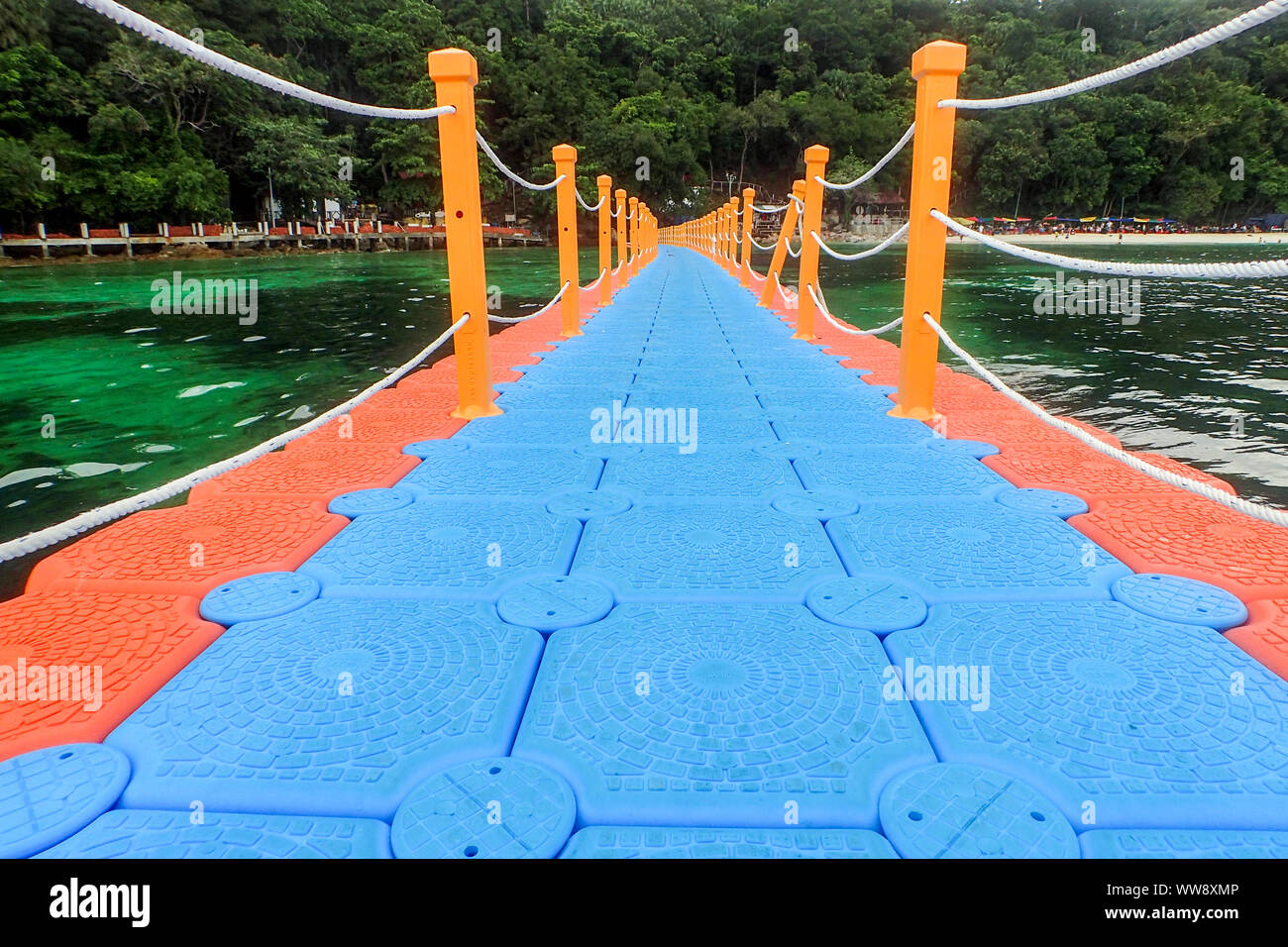 Colorful pontoon floating on seashore connecting boats landing to the ...