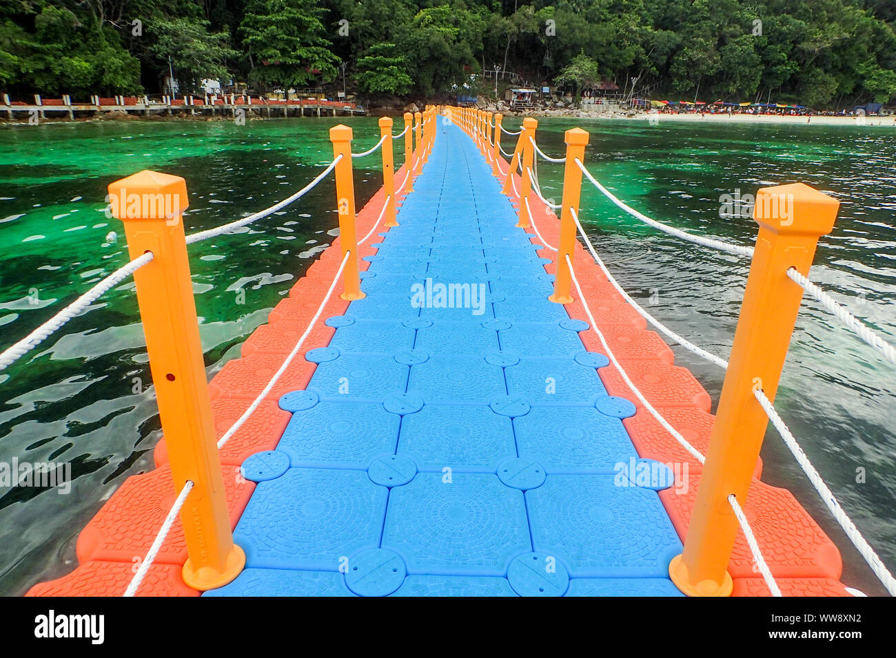 Colorful pontoon floating on seashore connecting boats landing to the ...