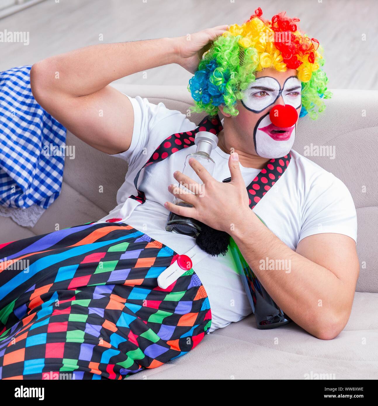 The drunk clown celebrating having a party at home Stock Photo - Alamy