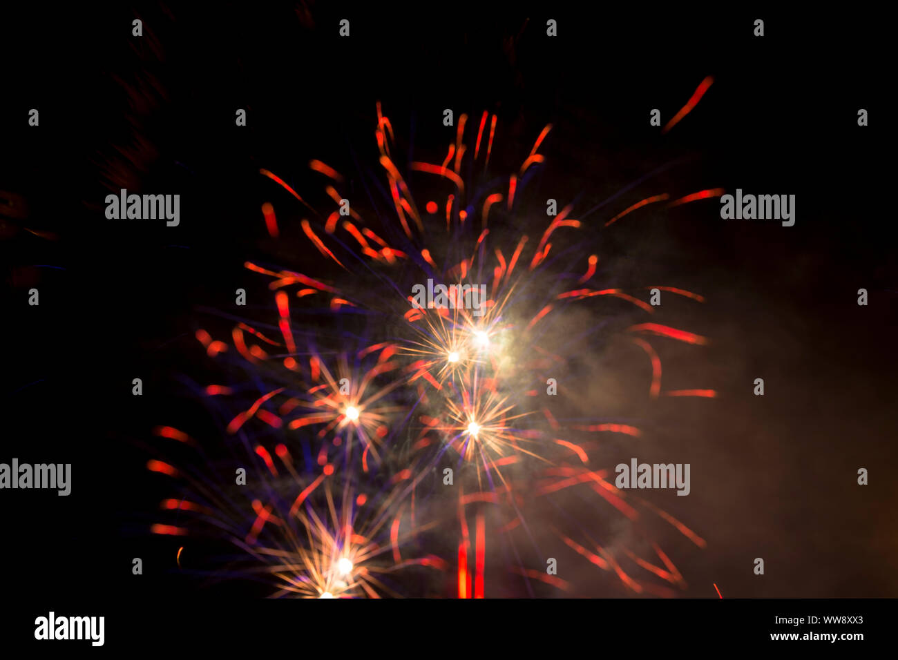 Night burst of beautiful firework celebration with colorful glow ...