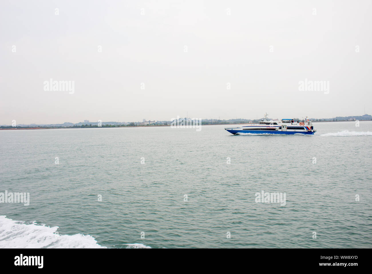 BATAM, INDONESIA - 12 DECEMBER 2018: Ferry and ships transporting ...
