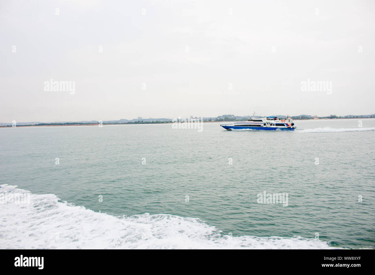 BATAM, INDONESIA - 12 DECEMBER 2018: Ferry and ships transporting ...
