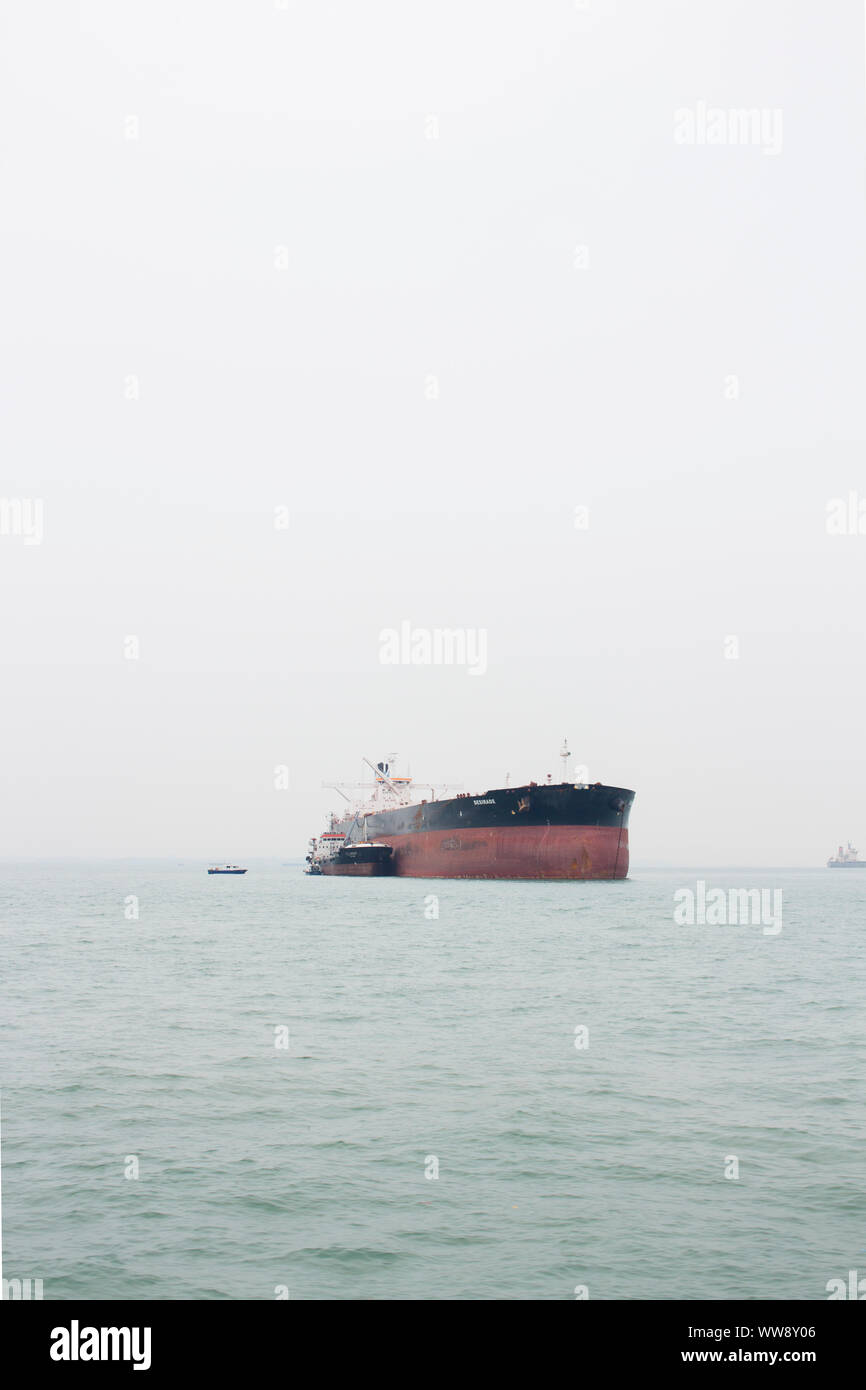BATAM, INDONESIA - 12 DECEMBER 2018: Ferry and ships transporting ...