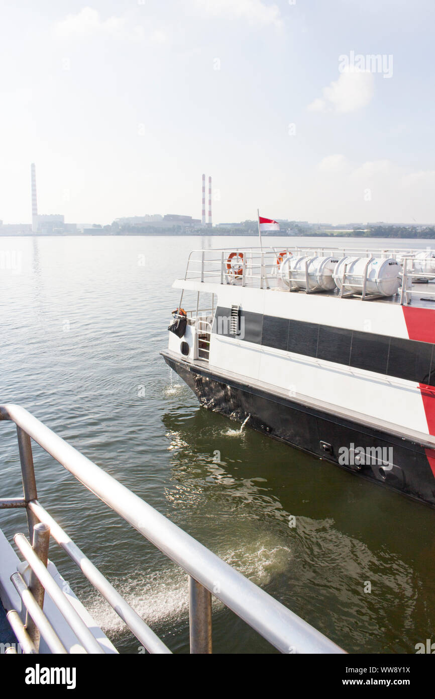 BATAM, INDONESIA - 12 DECEMBER 2018: Ferry and ships transporting ...