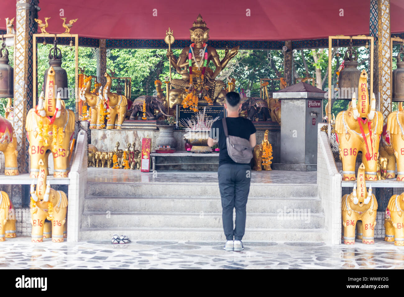 Religious guy praying at a buddhist temple in Hat Yai Thailand Stock ...