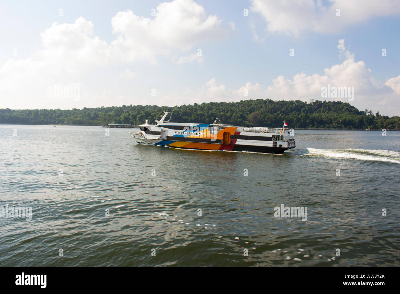 BATAM, INDONESIA - 12 DECEMBER 2018: Ferry and ships transporting ...